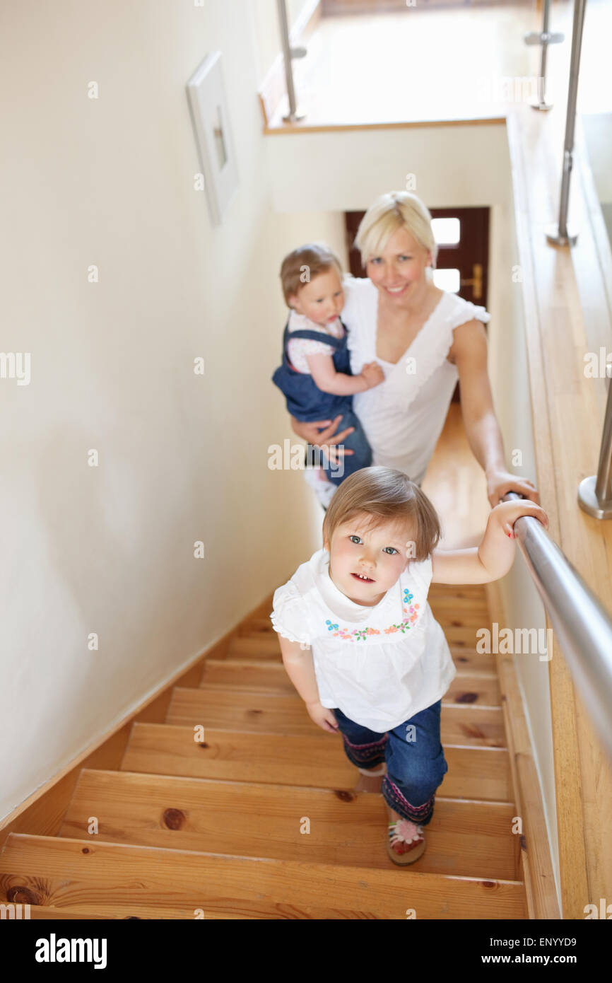 Family going upstairs Stock Photo - Alamy