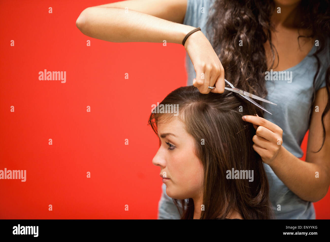 Student hairdresser cutting hair Stock Photo - Alamy