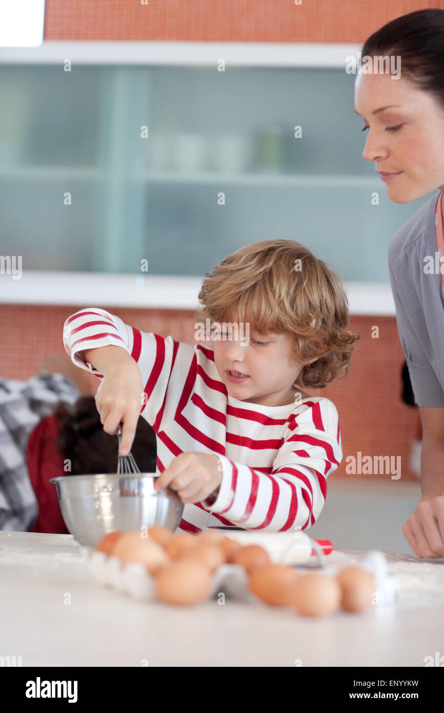 Little boy working in the kitchen Stock Photo - Alamy
