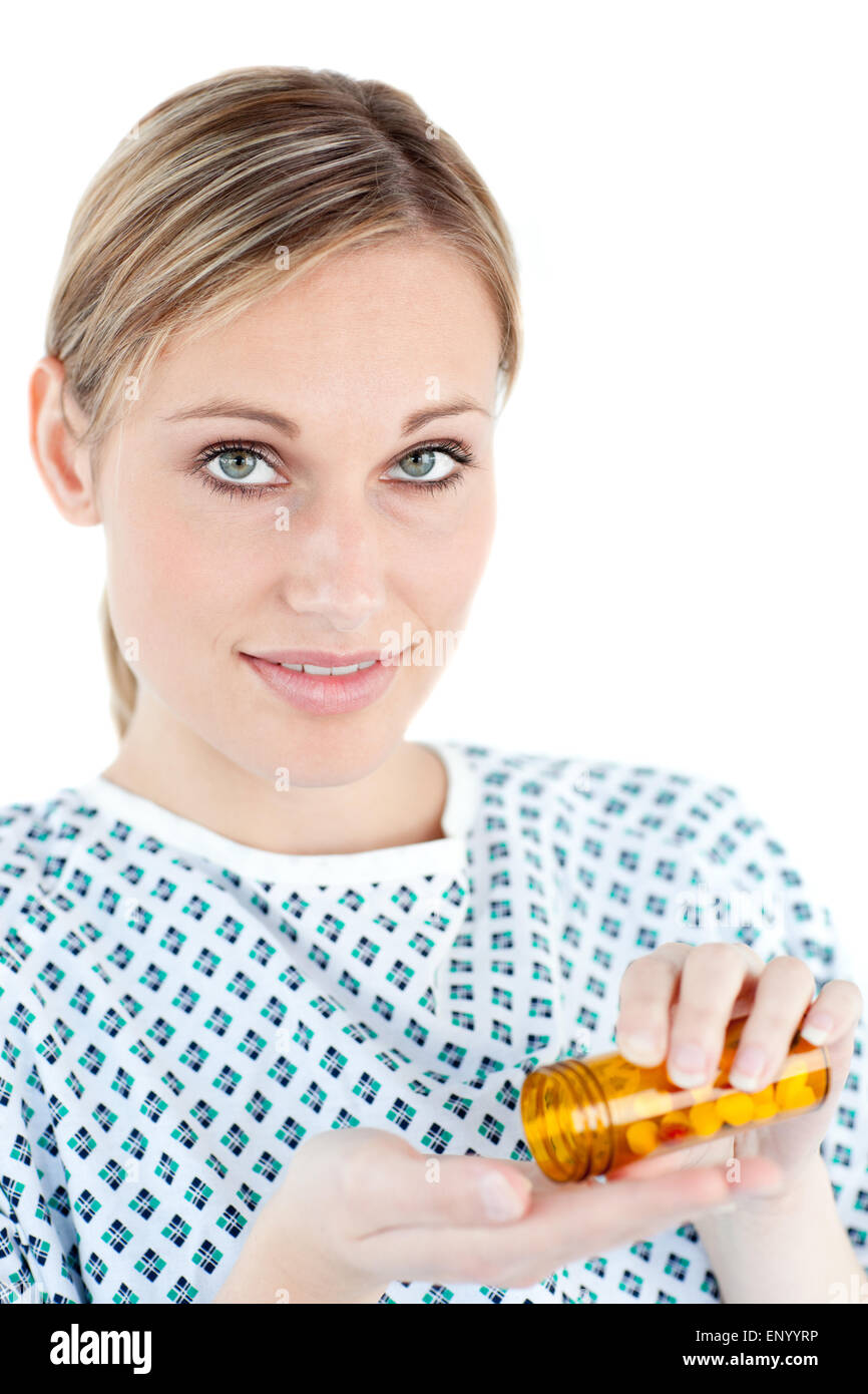Female patient taking pills against white background Stock Photo - Alamy