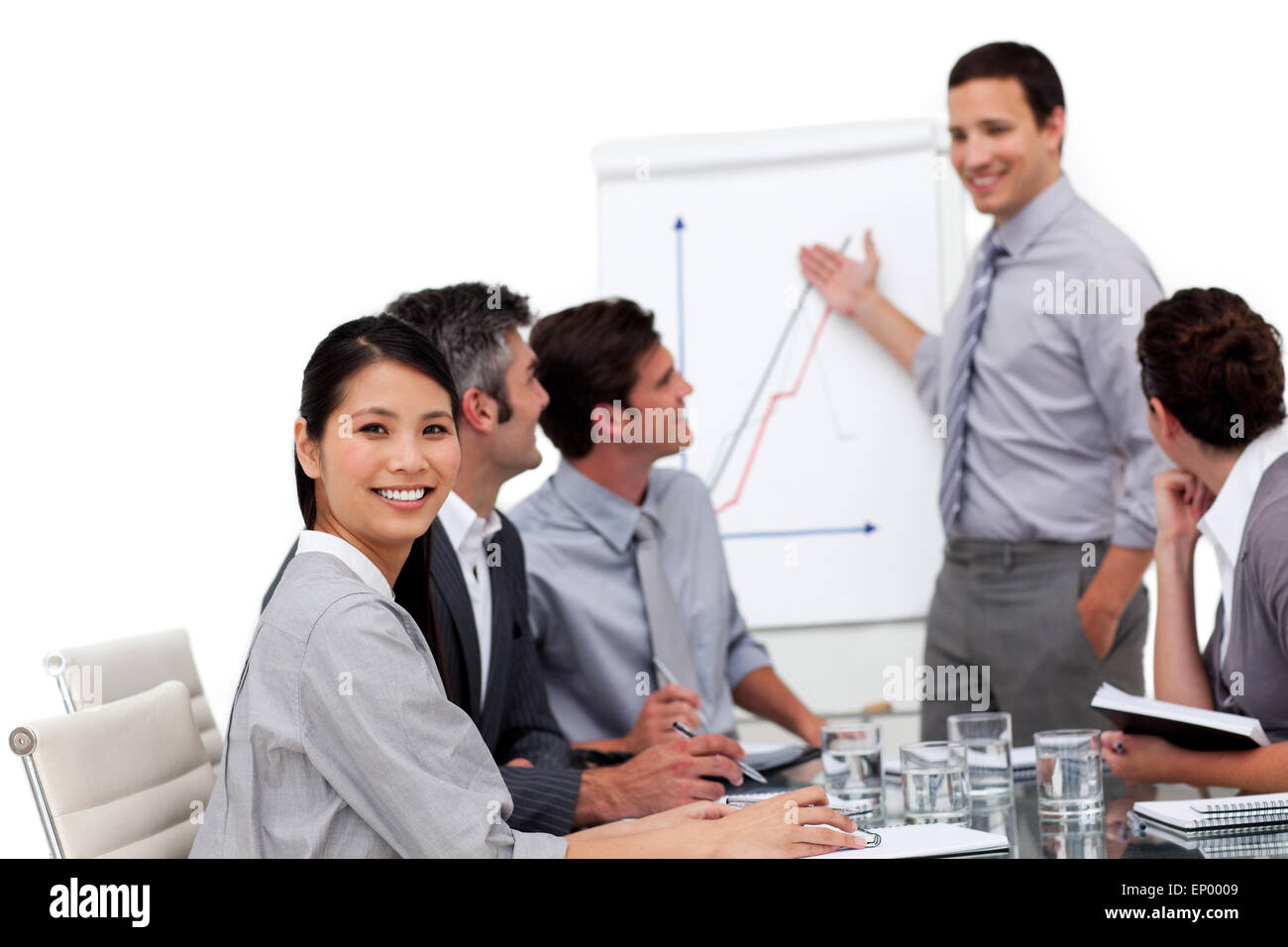 Positive manager giving a presentation against a white background Stock ...