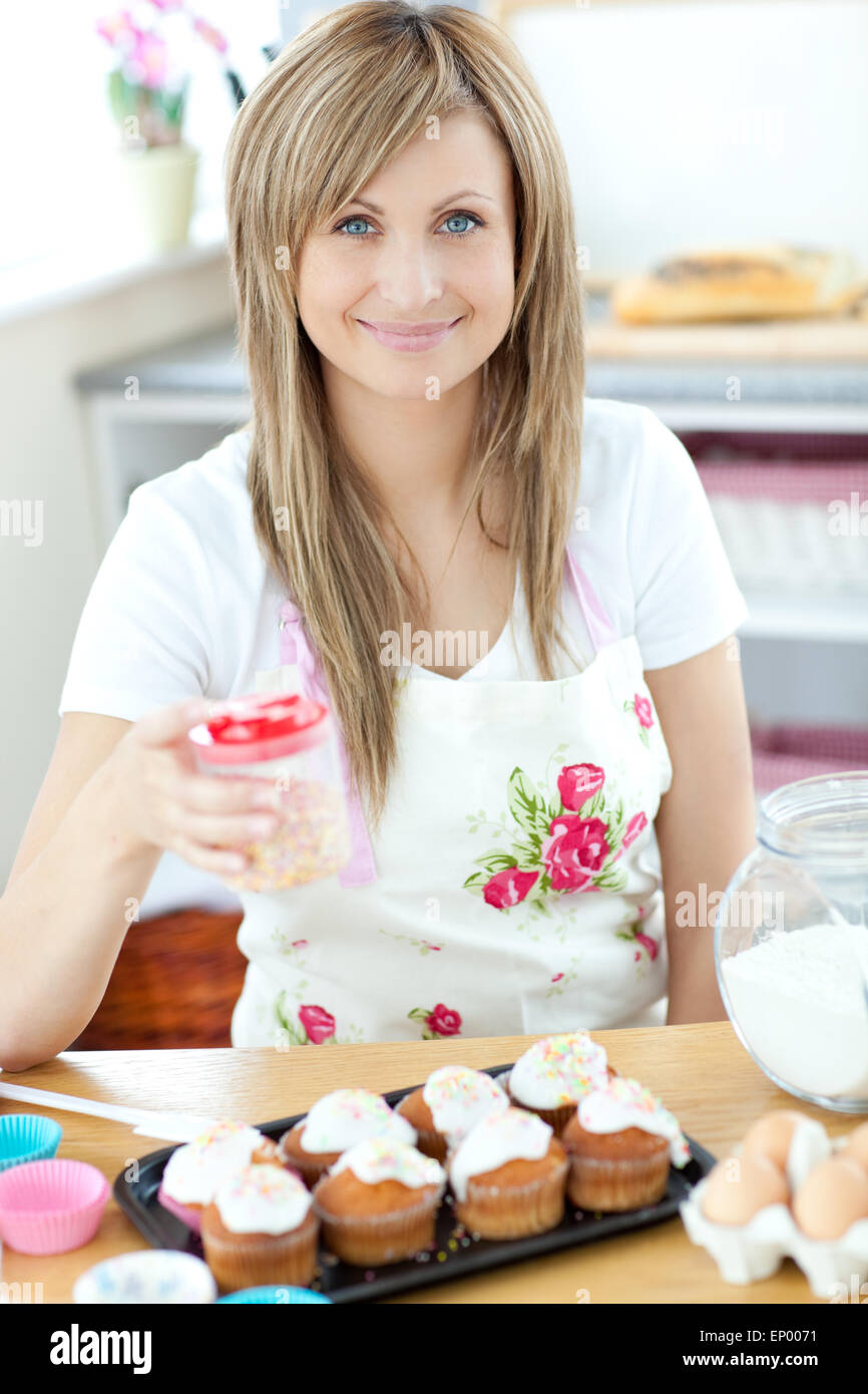 Caucasian woman cooking cakes in the kitchen Stock Photo - Alamy