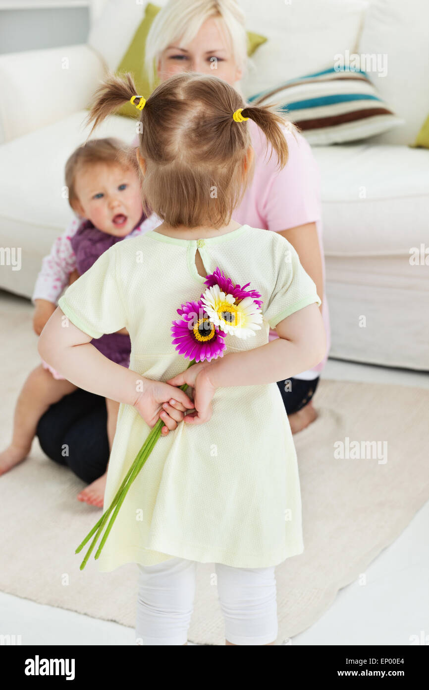 Sweet woman get surprise by her daughters Stock Photo - Alamy