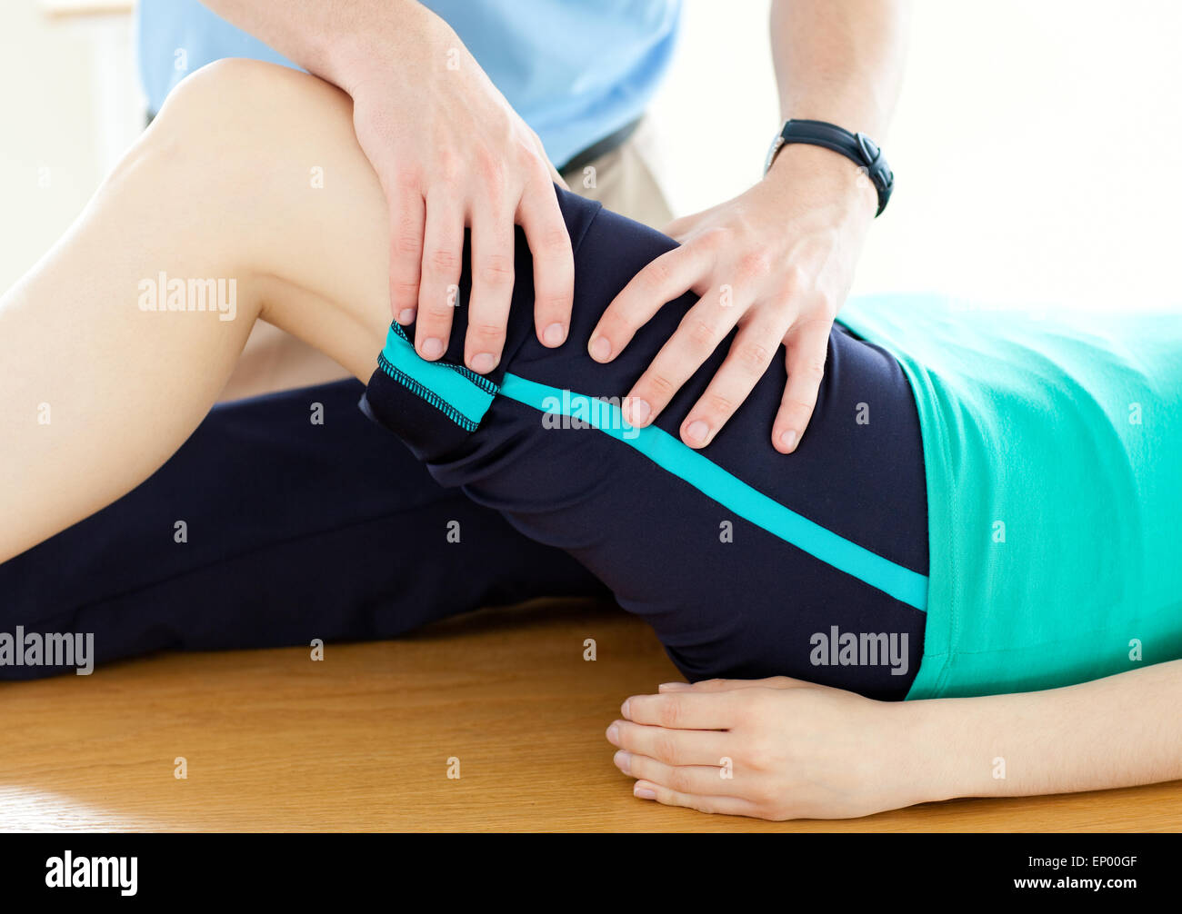 Therapist doing fitness exercises with a woman Stock Photo - Alamy