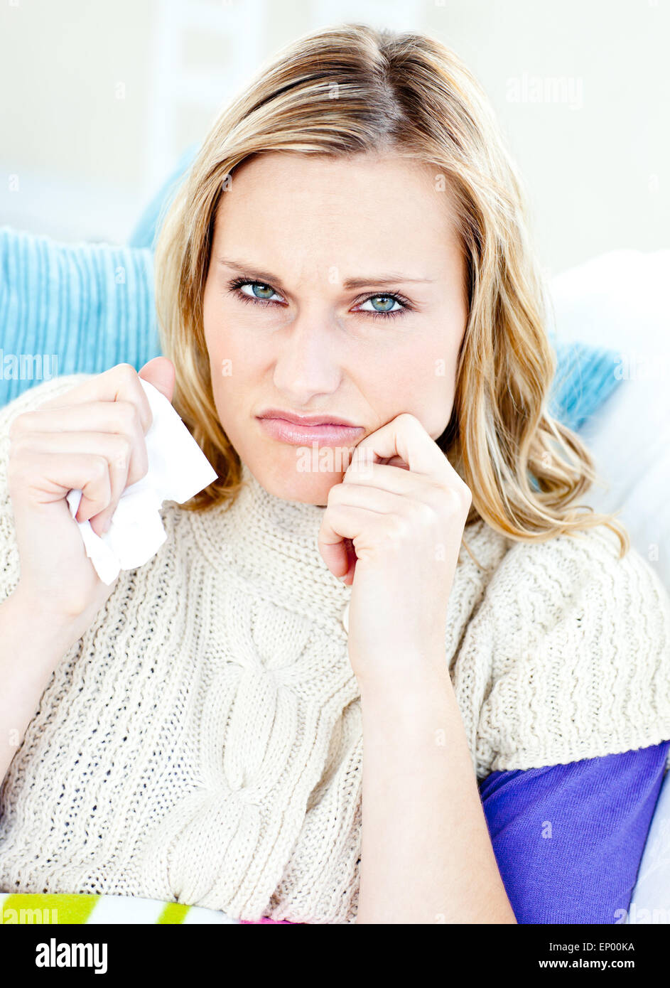 Portrait of a sick woman lying on a sofa Stock Photo - Alamy