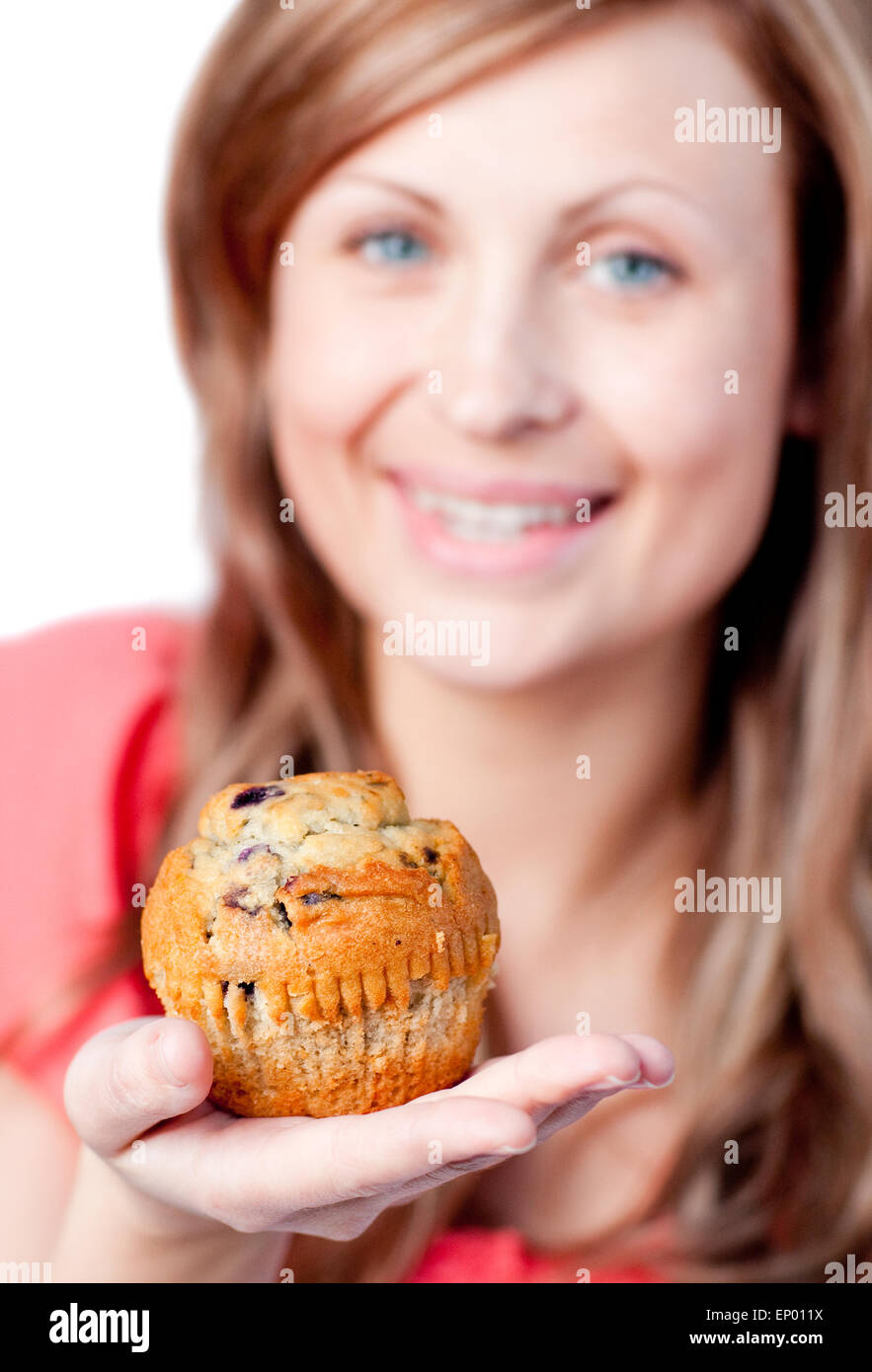 Delighted woman is eating a muffin Stock Photo - Alamy