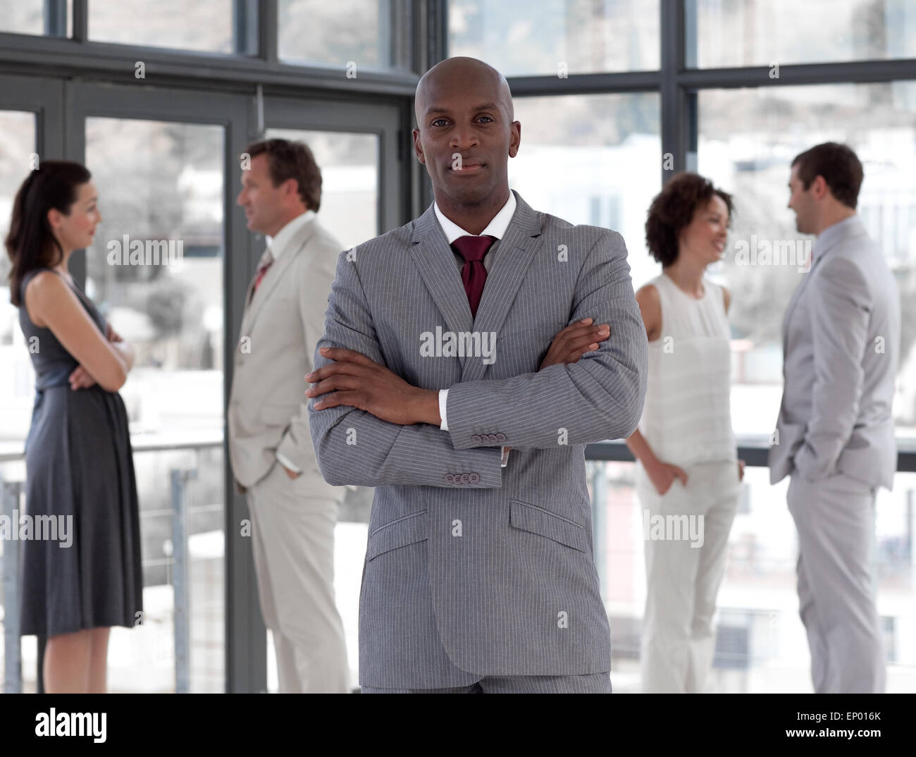 portrait of an african manager leading his team Stock Photo - Alamy