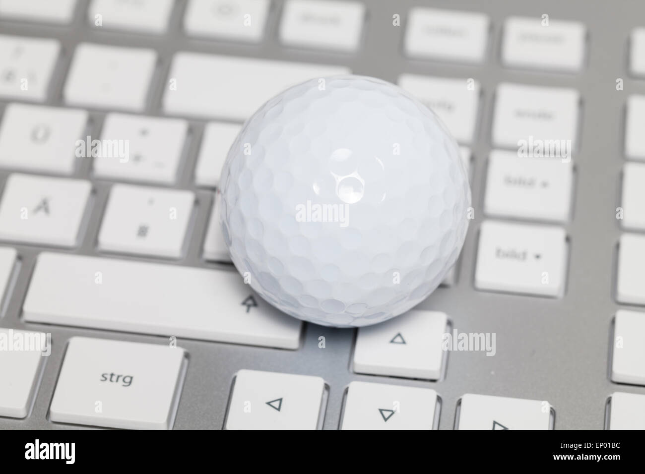 Golf ball on keyboard Stock Photo - Alamy