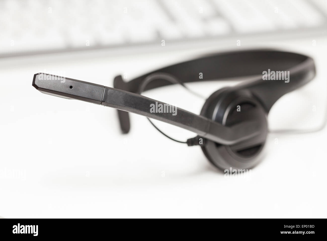 Headset on desk Stock Photo - Alamy