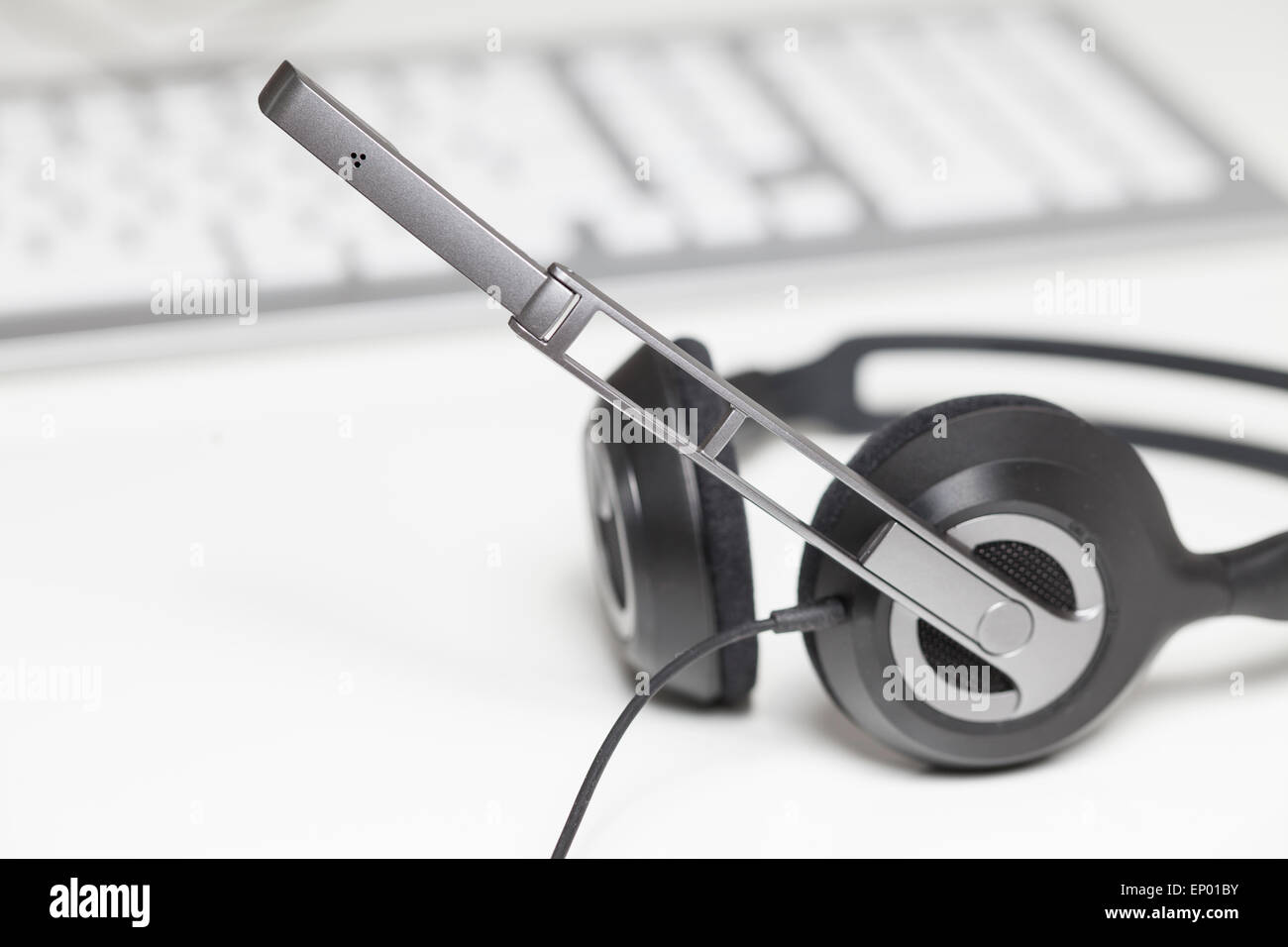 Headset on desk Stock Photo - Alamy