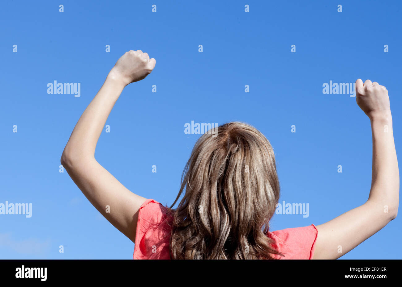 Happy woman punching the air outdoor Stock Photo - Alamy
