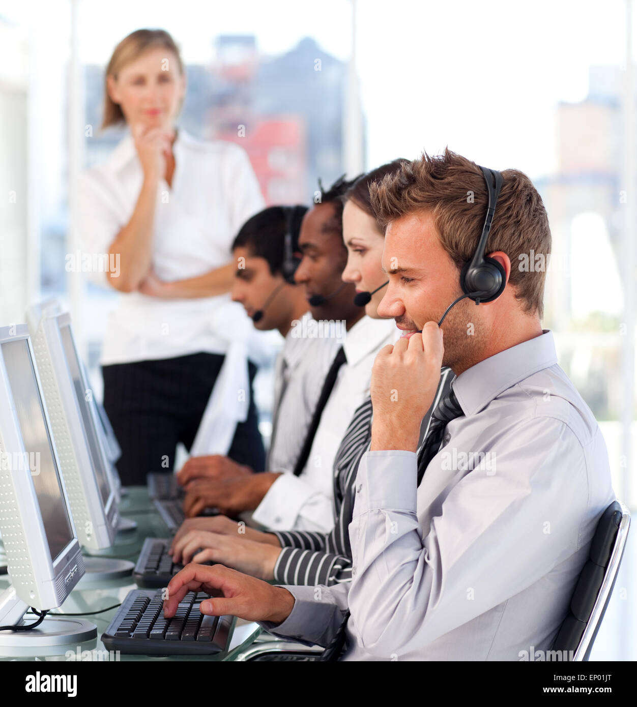 Pretty female manager leading her representative team Stock Photo - Alamy