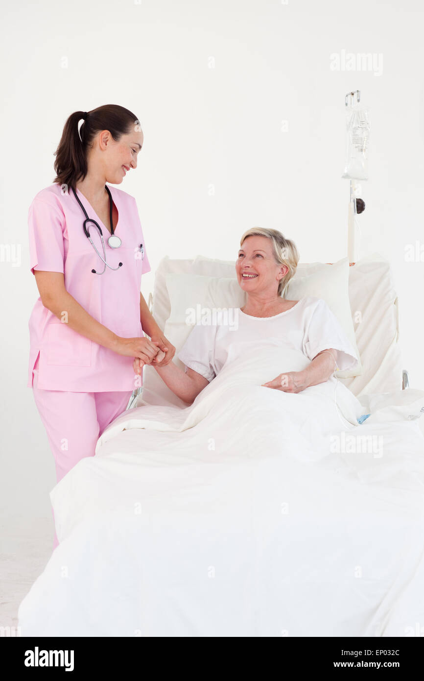 Young confident nurse with a friendly patient Stock Photo - Alamy