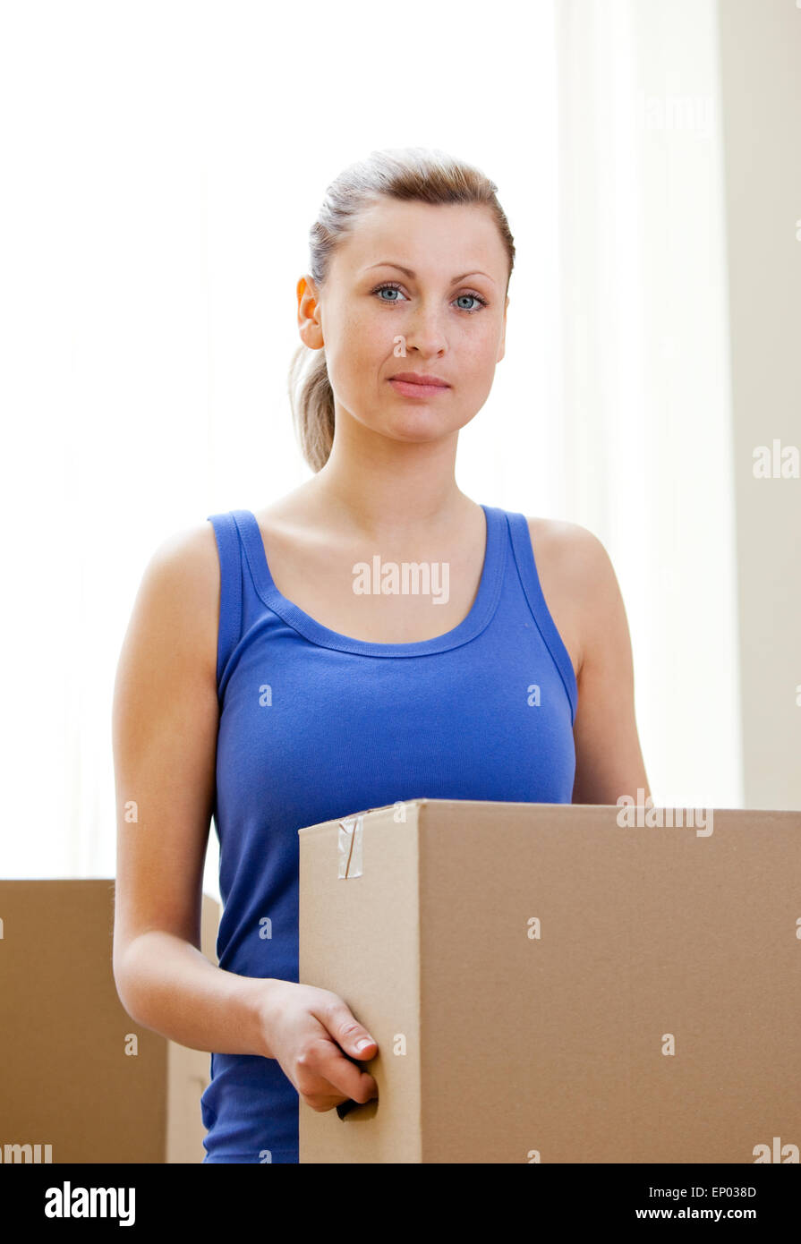 Young woman having a break between boxes Stock Photo - Alamy