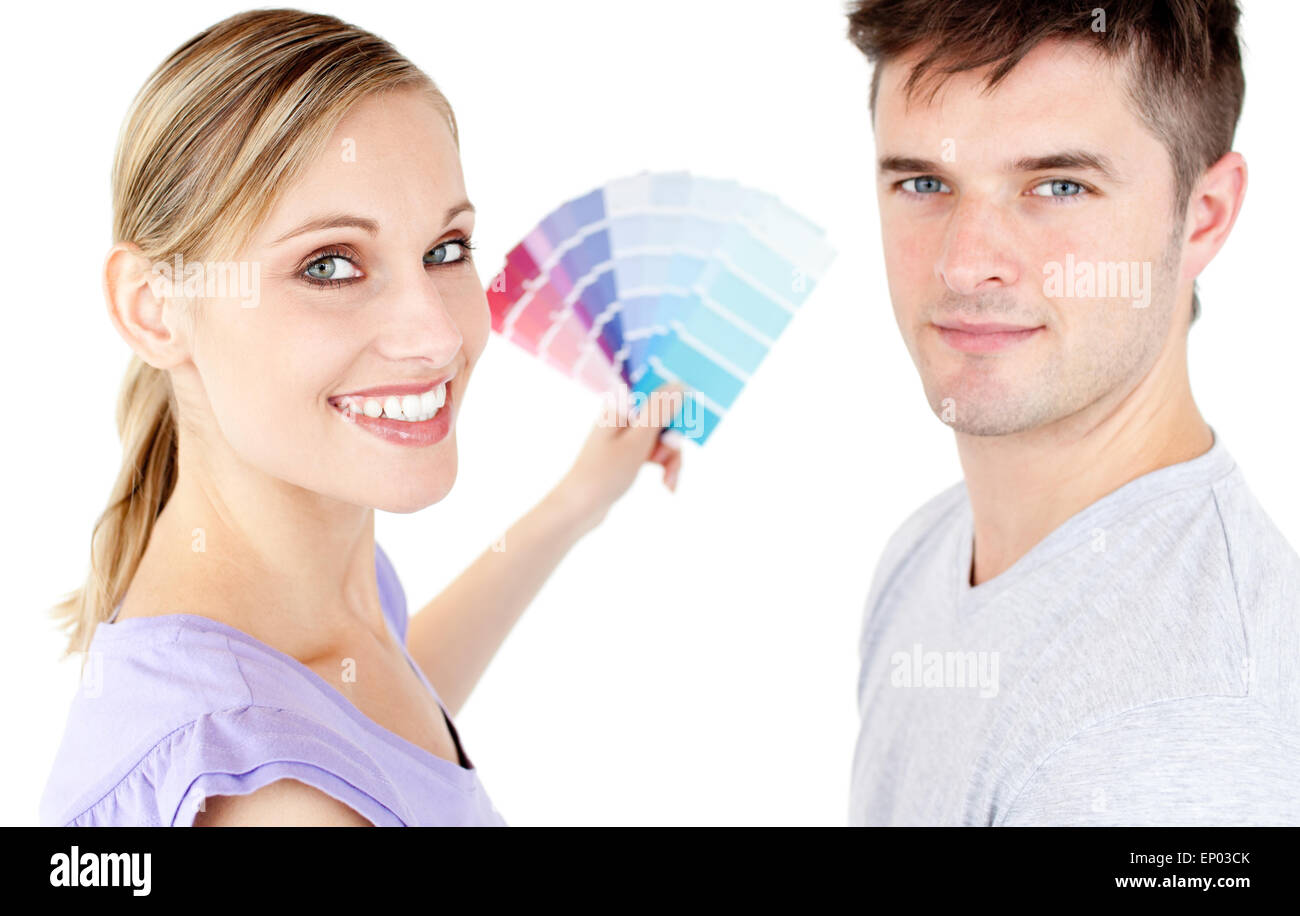 Happy couple with color samples to paint their new appartment Stock ...