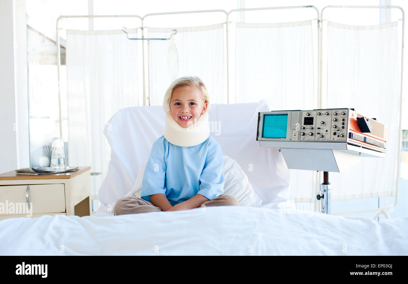A patient with a neck brace sitting on a hospital bed Stock Photo - Alamy