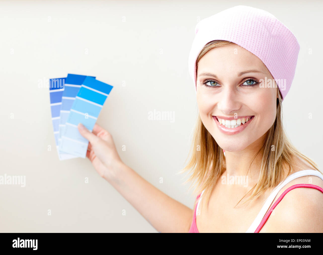 Joyful young woman choosing color for painting a room Stock Photo - Alamy