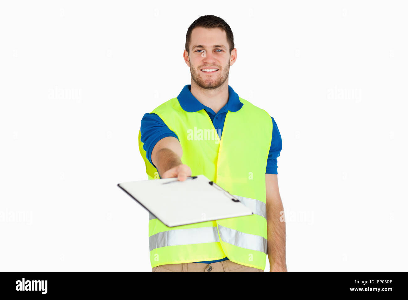 Smiling young delivery man asking for signature on delivery bill Stock ...