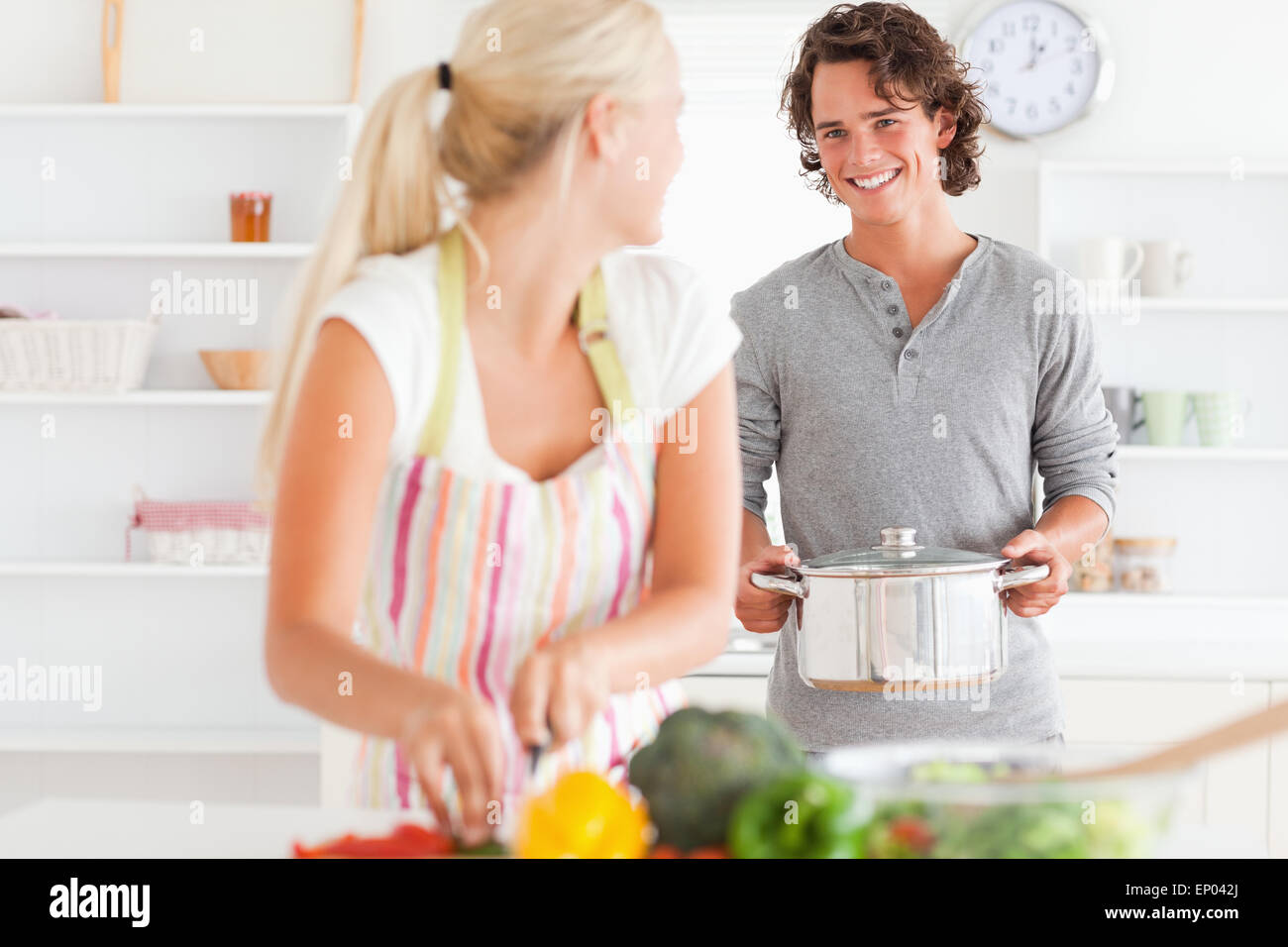Young couple cooking Stock Photo - Alamy