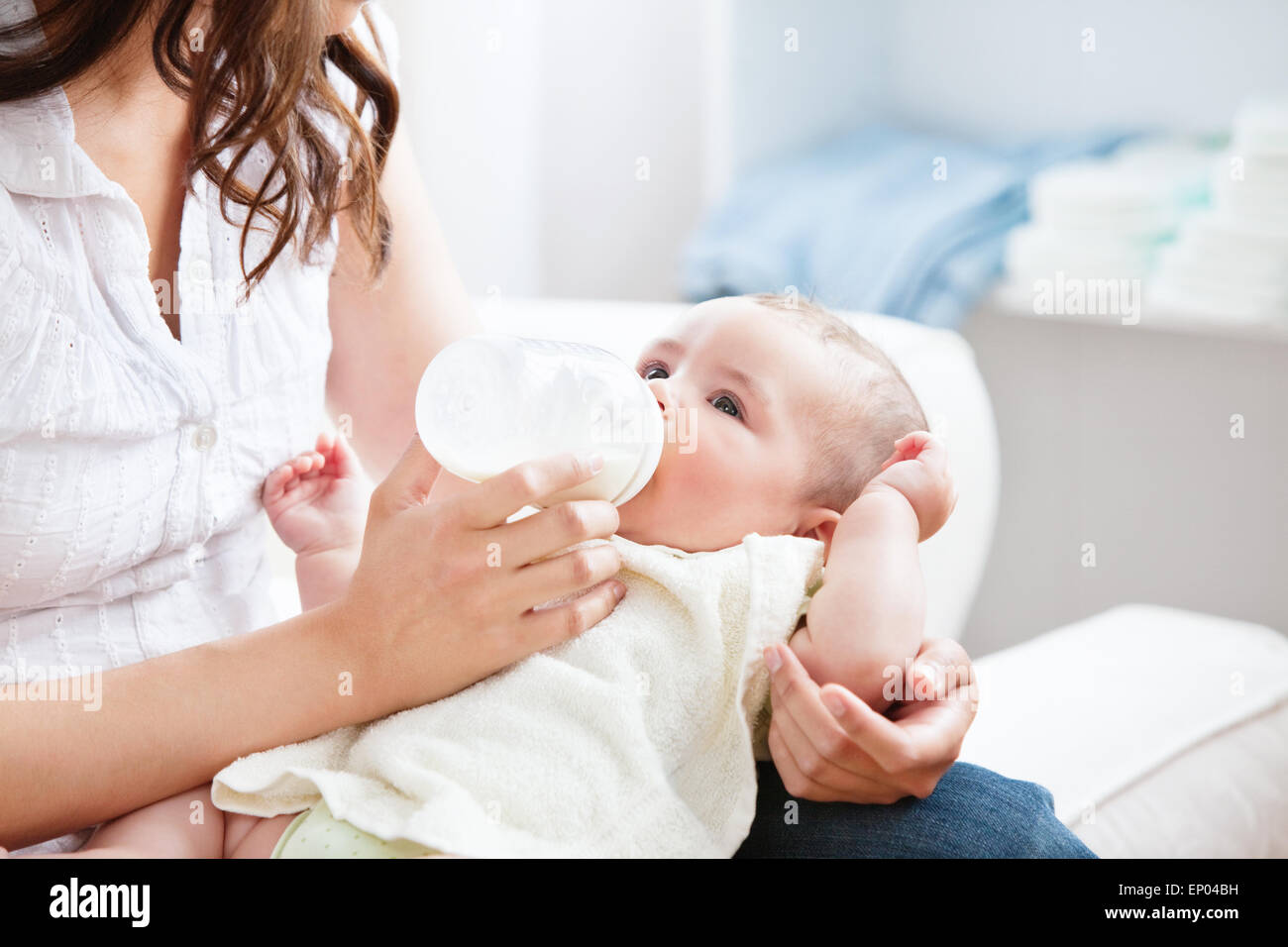 Bright mother feeding her adorable son in the kitchen Stock Photo - Alamy