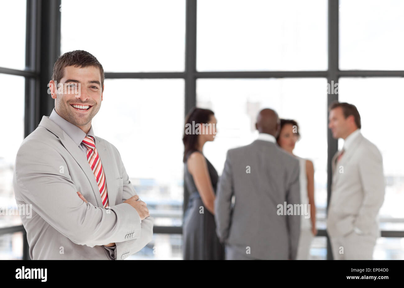 Professional male manager leading his team Stock Photo - Alamy