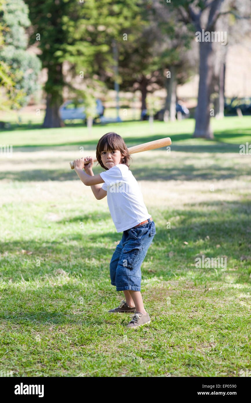 Adorable little boy playing baseball Stock Photo - Alamy
