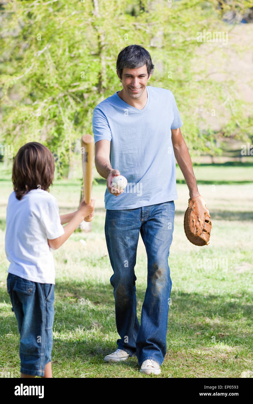 Adorable little boy playing baseball with his father Stock Photo - Alamy