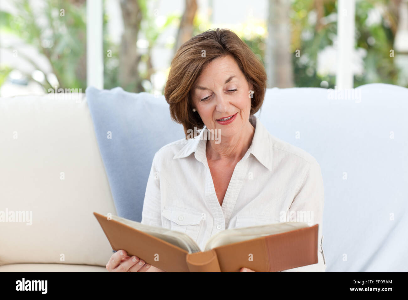 Old woman reading her book Stock Photo - Alamy
