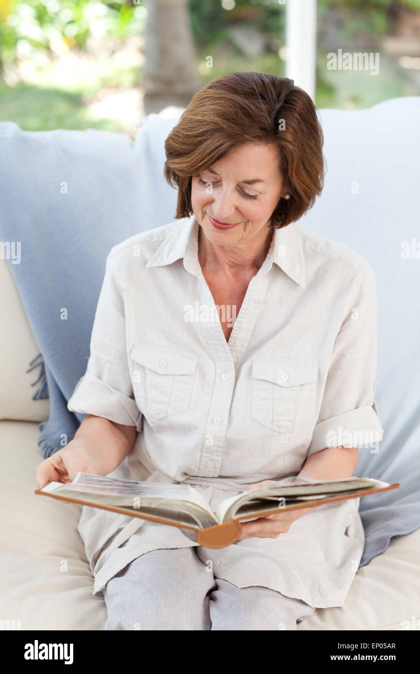 Retired woman reading her book Stock Photo - Alamy