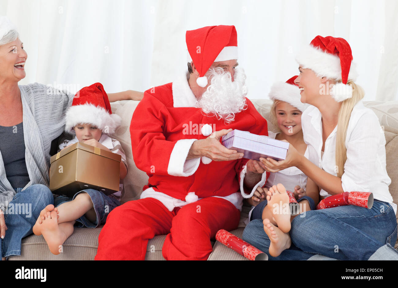 Santa Claus with a happy family Stock Photo - Alamy