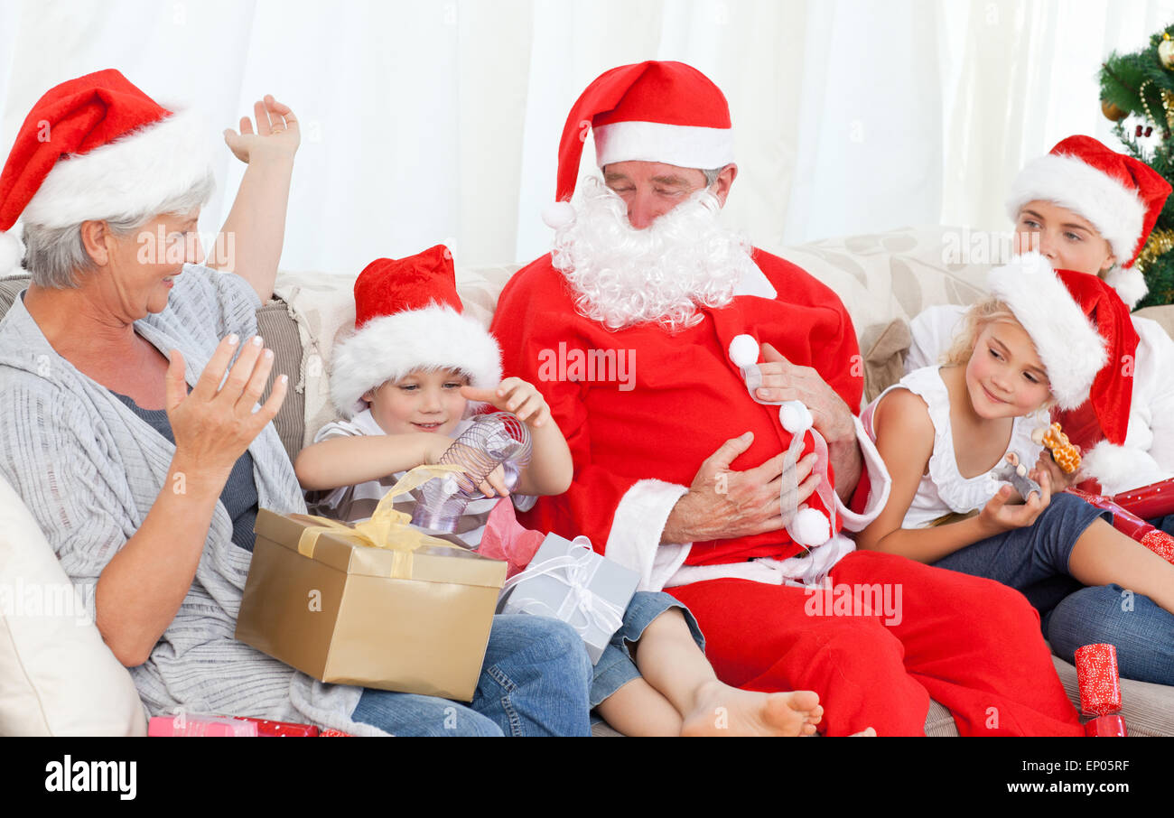 Santa Claus with a happy family Stock Photo - Alamy