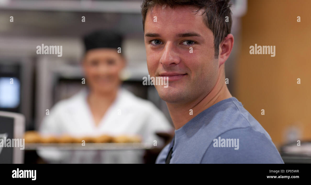 Handsome male customer in a bakery Stock Photo - Alamy