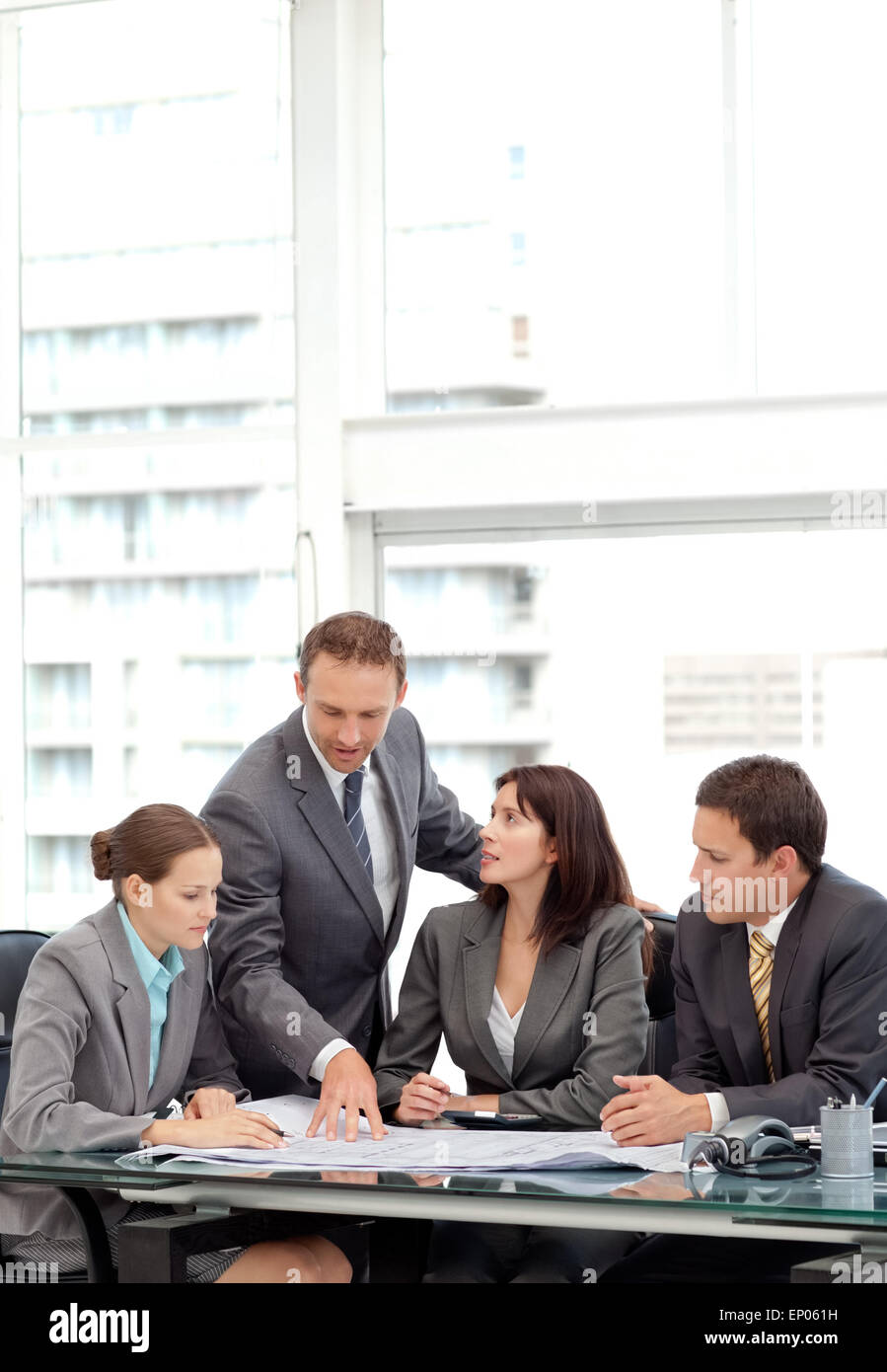 Successful manager showing a plan to his team during a meeting Stock ...