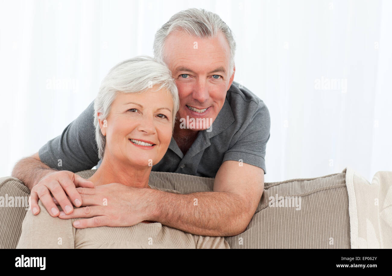 Lovers hugging while they are looking at the camera Stock Photo - Alamy