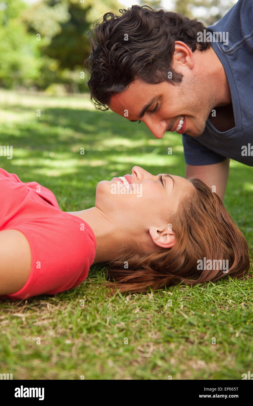 Man looking down into his smiling friends eyes Stock Photo - Alamy