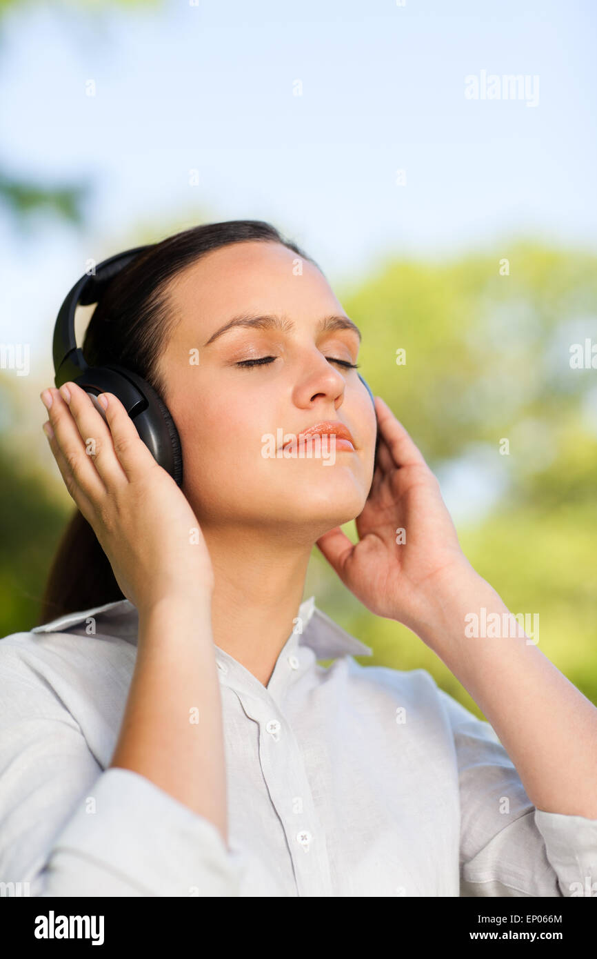 Beautiful woman listening to music Stock Photo - Alamy
