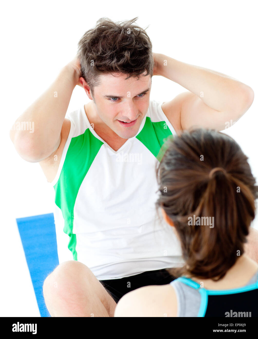 Handsome man doing fitness exercises with a woman in gym Stock Photo ...