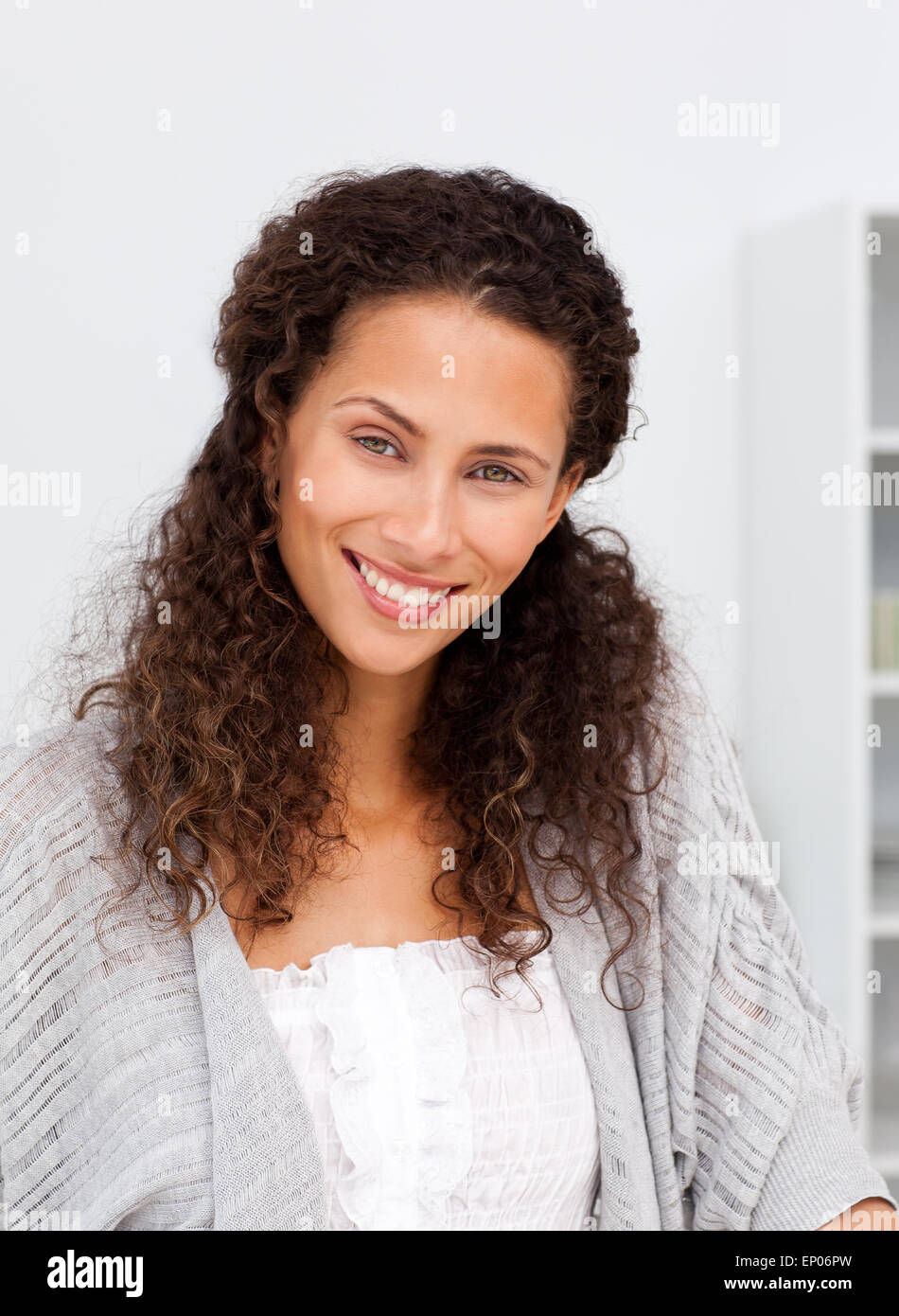 Cute woman looking at the camera standing in a kitchen Stock Photo - Alamy