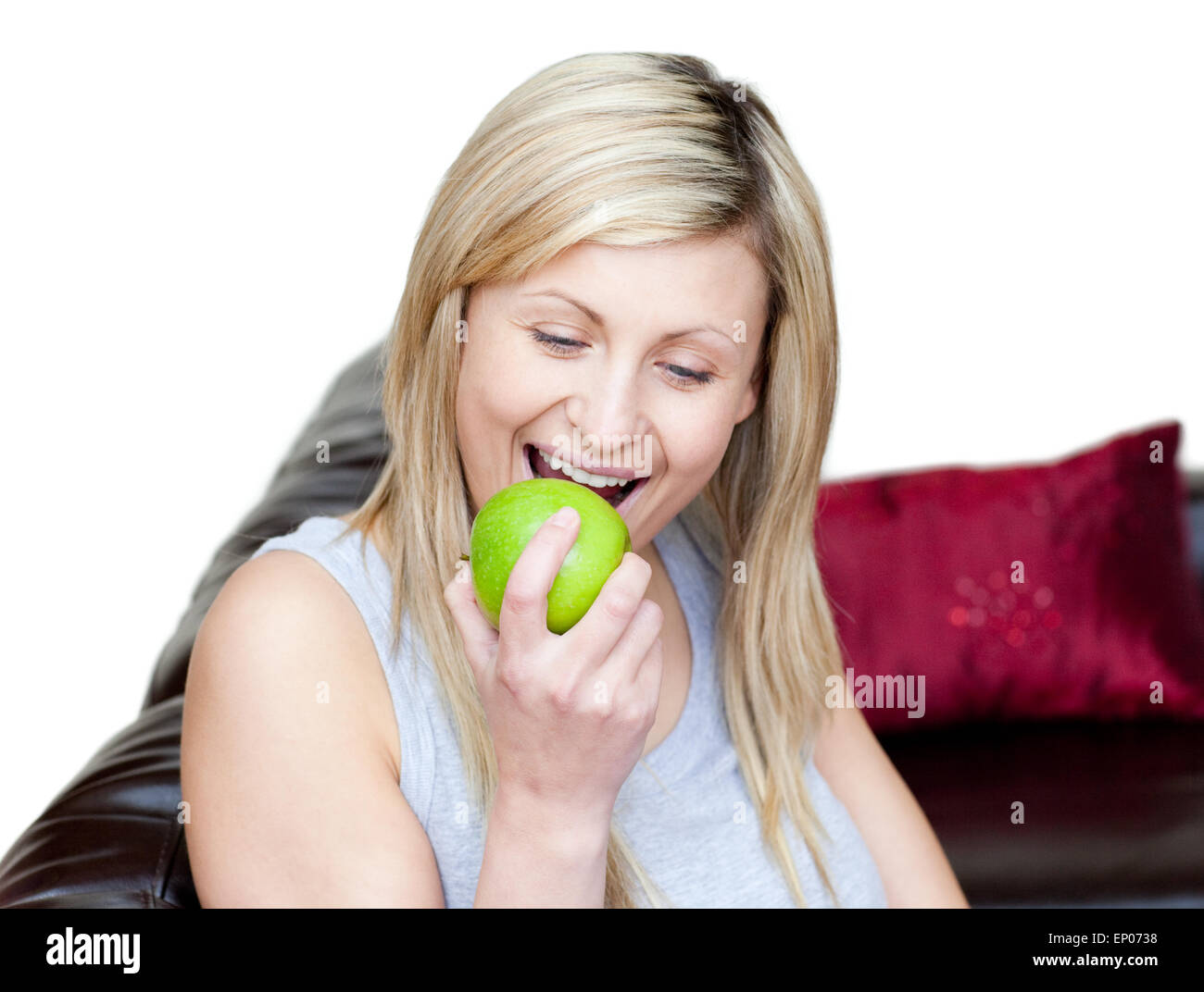 Bright woman eating an apple against a white background Stock Photo - Alamy