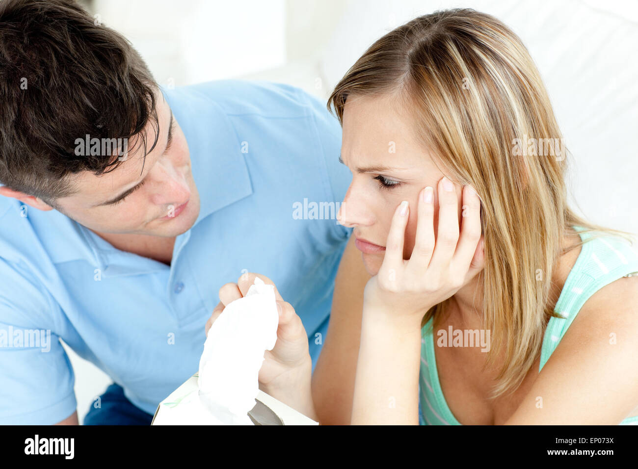 Tired couple having an argue in the living-room Stock Photo - Alamy