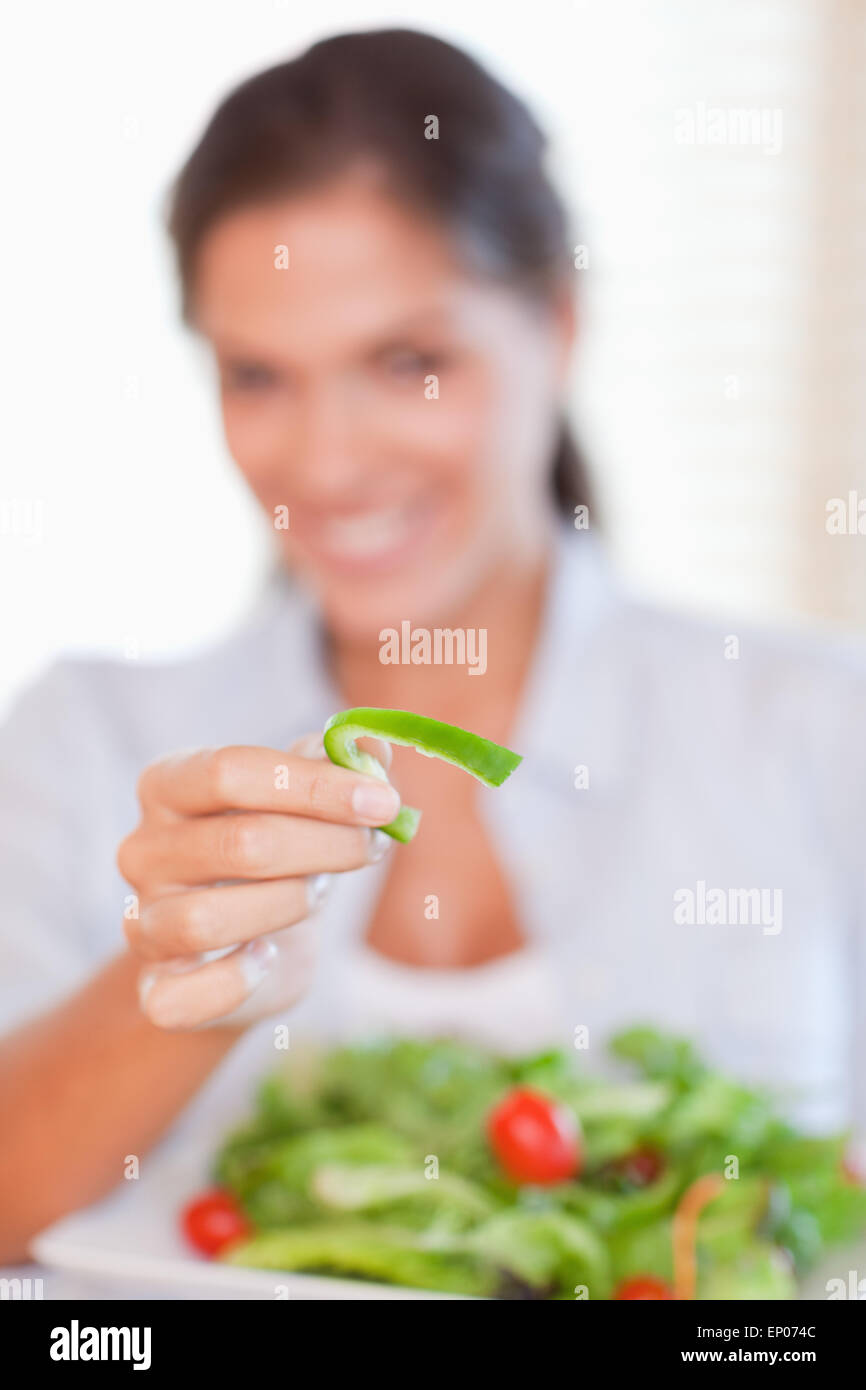 Portrait of a smiling woman eating a salad Stock Photo - Alamy