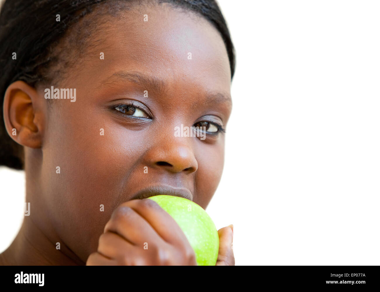 Sweet woman eating apple against white background Stock Photo - Alamy