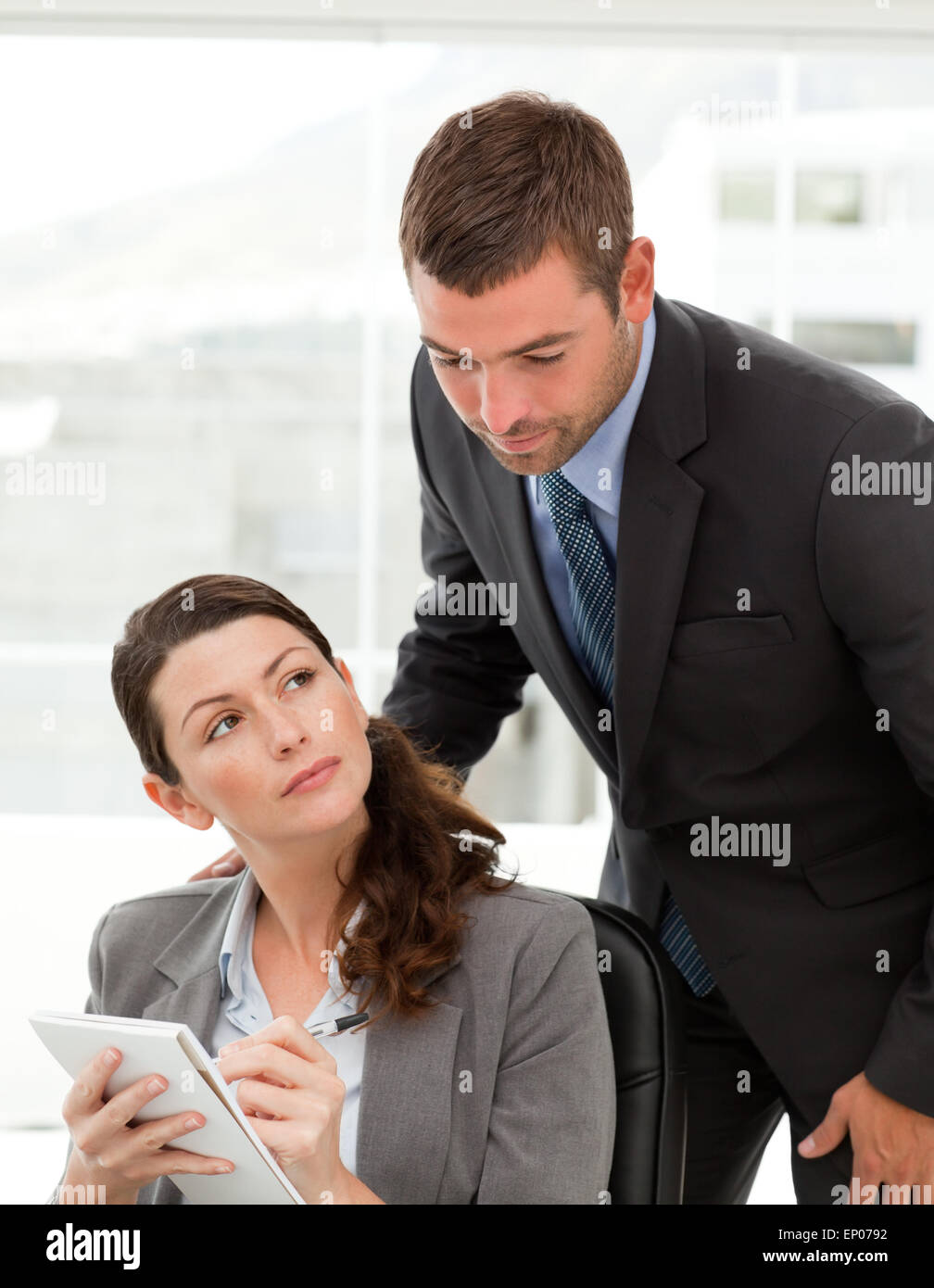 Beautiful office workers talking writing hi-res stock photography and ...