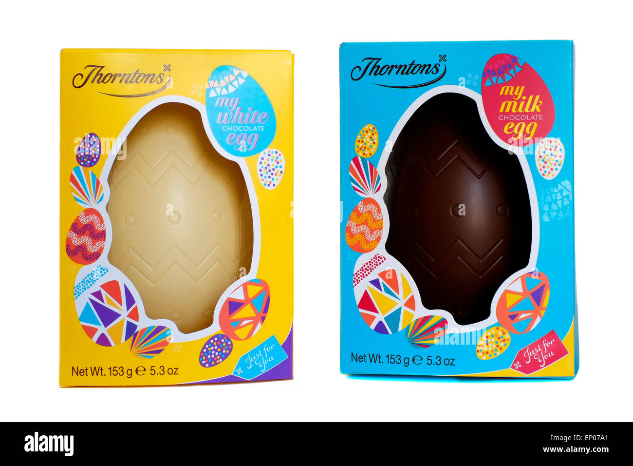 two boxed easter eggs one white and one milk chocolate against a white ...
