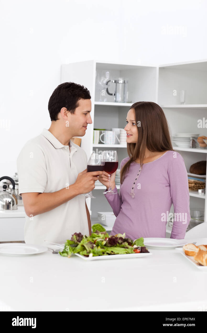 Young couple giving a toast during the lunch Stock Photo - Alamy