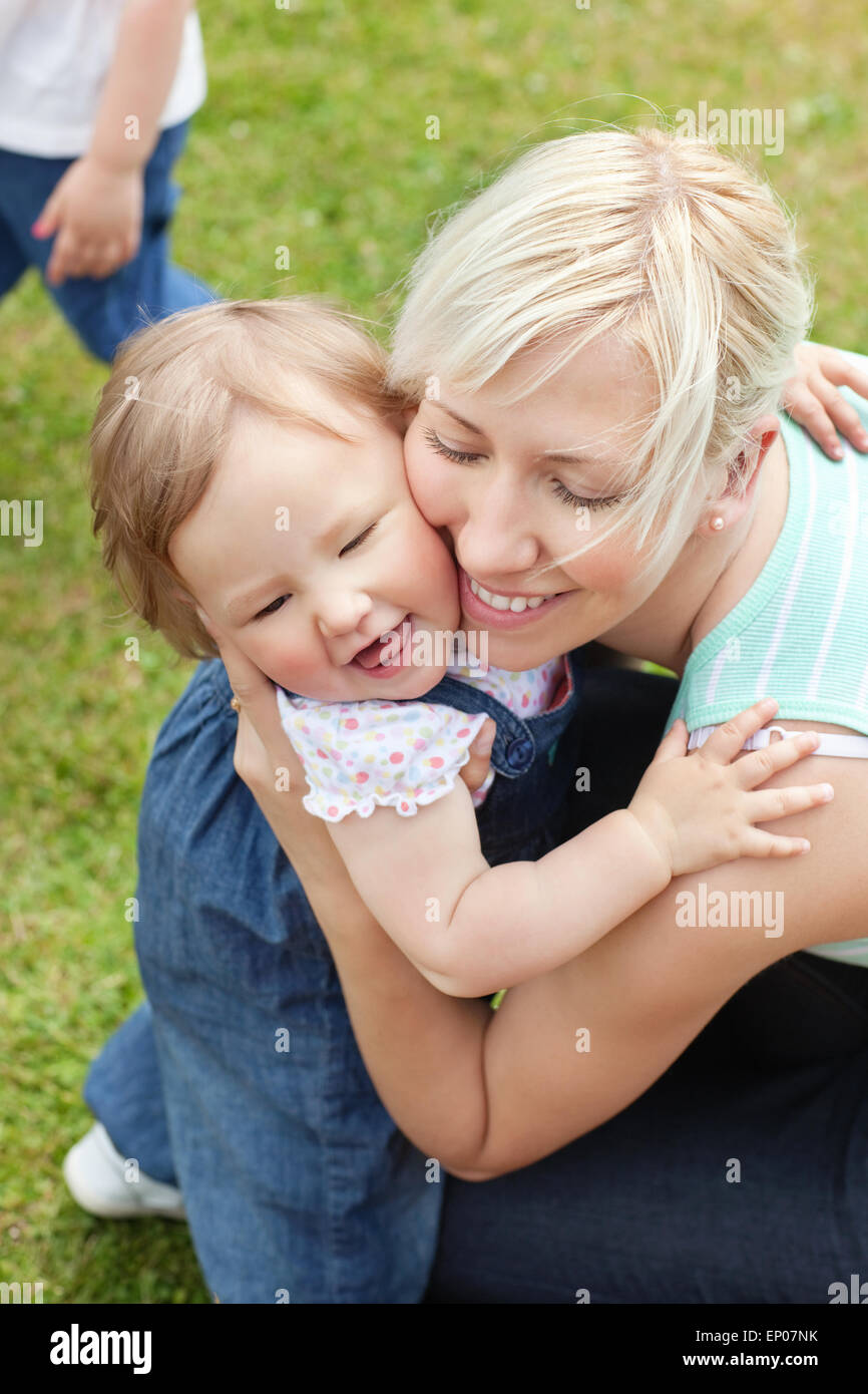 Laughing girl with woman in the sunshine Stock Photo - Alamy