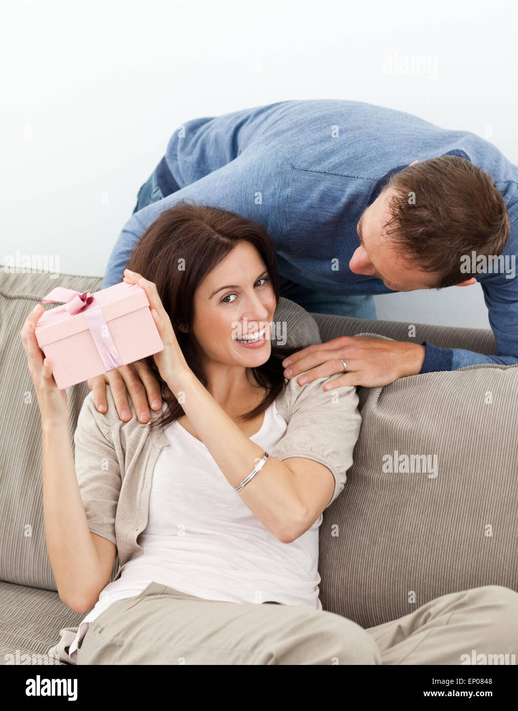 Happy woman trying to guess her present from her boyfriend Stock Photo ...