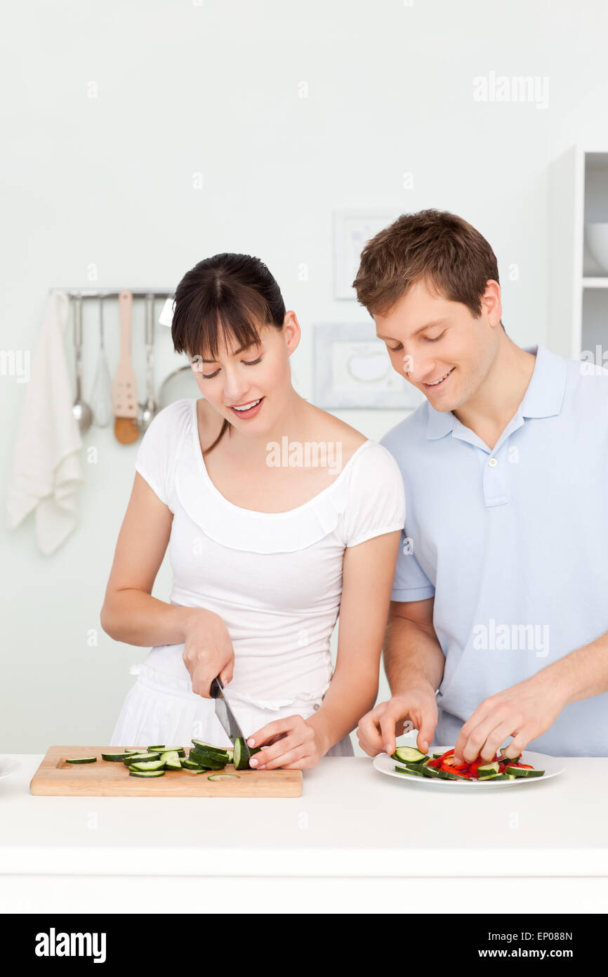 Lovers cooking together in the kitchen Stock Photo - Alamy
