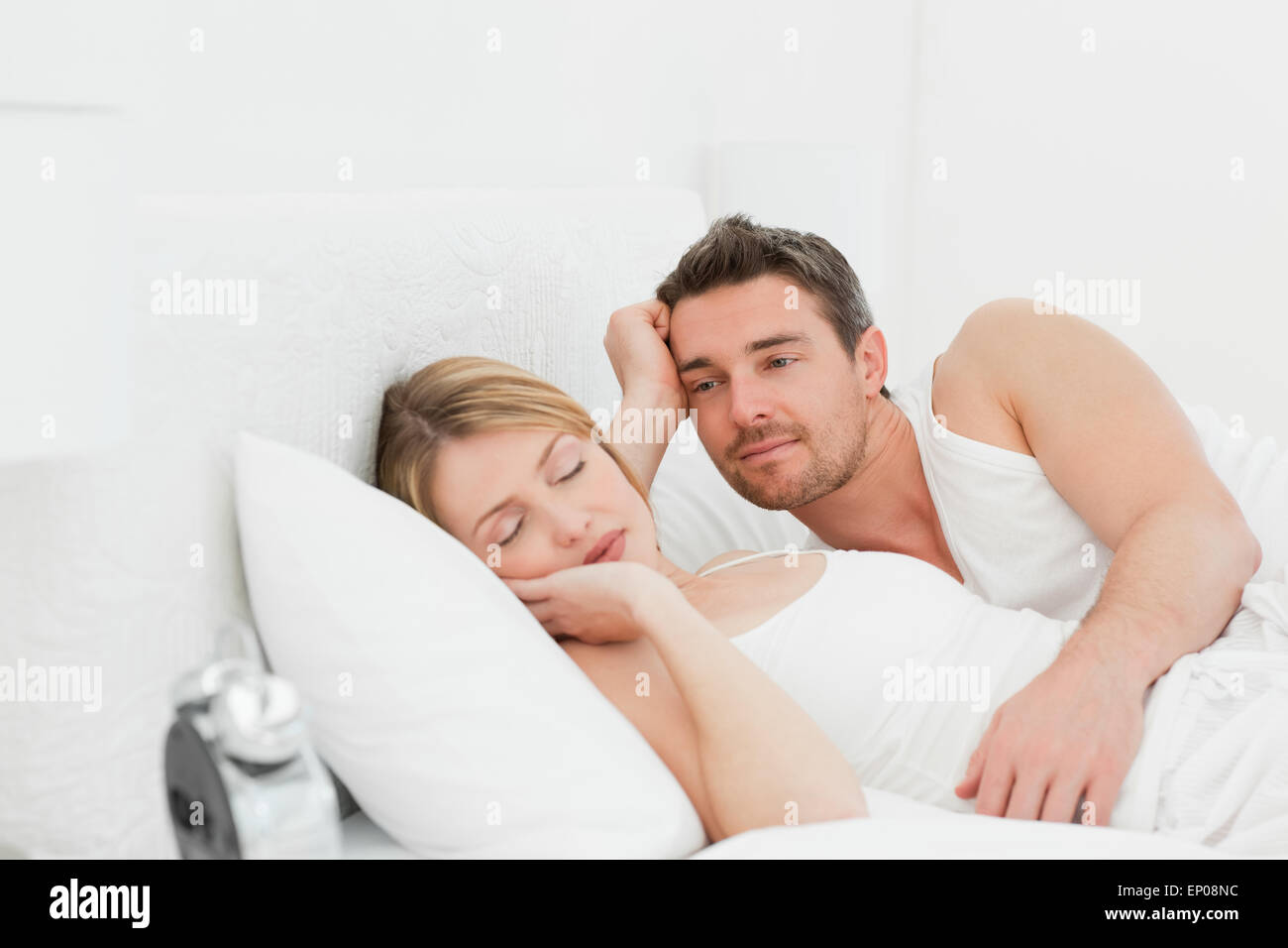 Boyfriend looking at his girlfriend who is sleeping Stock Photo - Alamy
