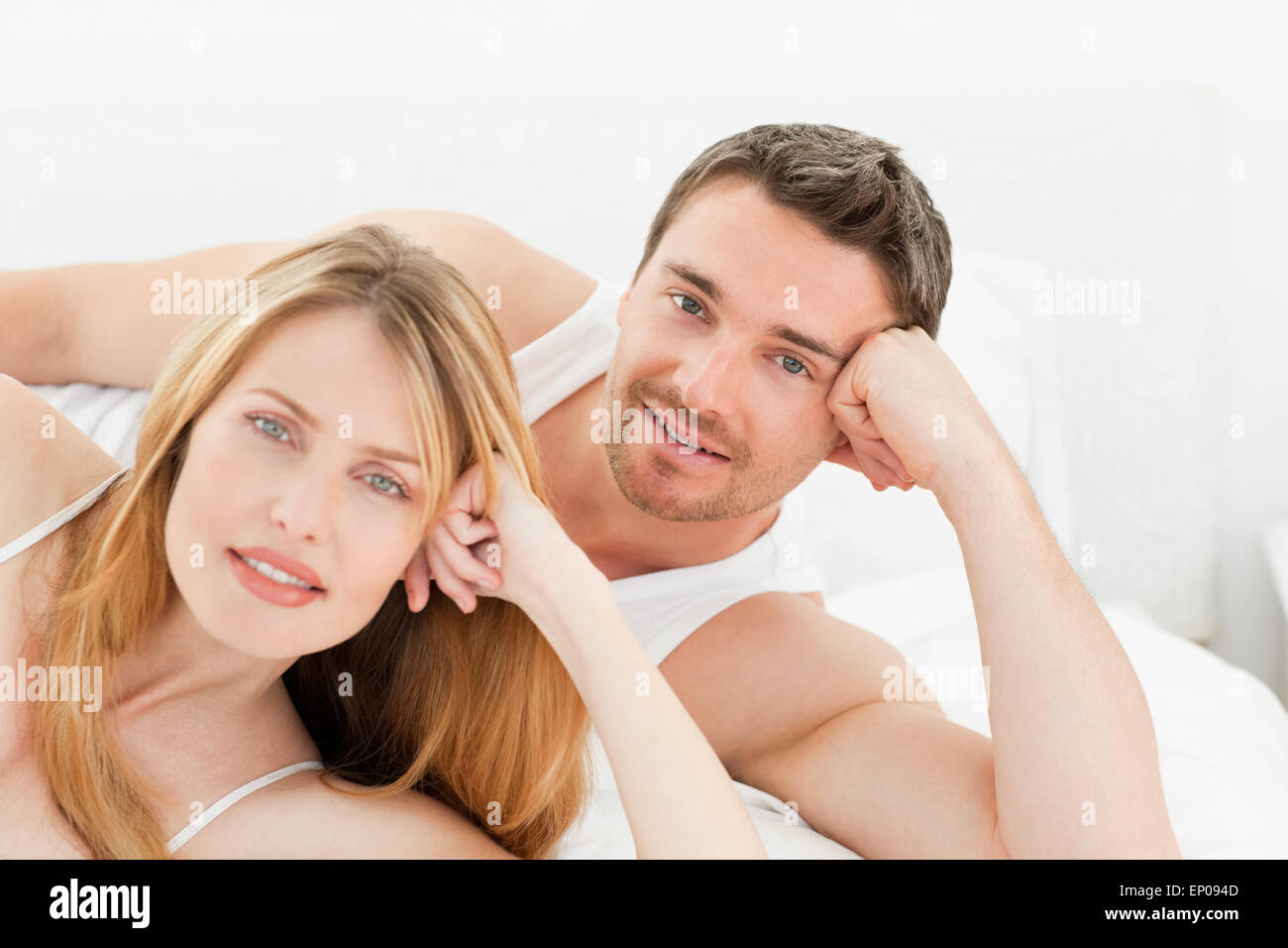 Happy lovers looking at the camera Stock Photo - Alamy